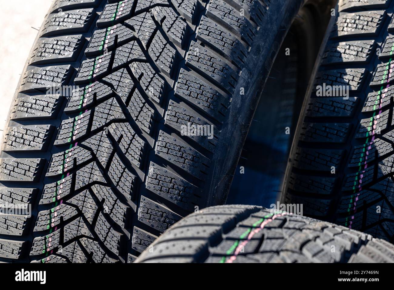 Sharp tread of new winter tires ready for the seasonal change. New ...