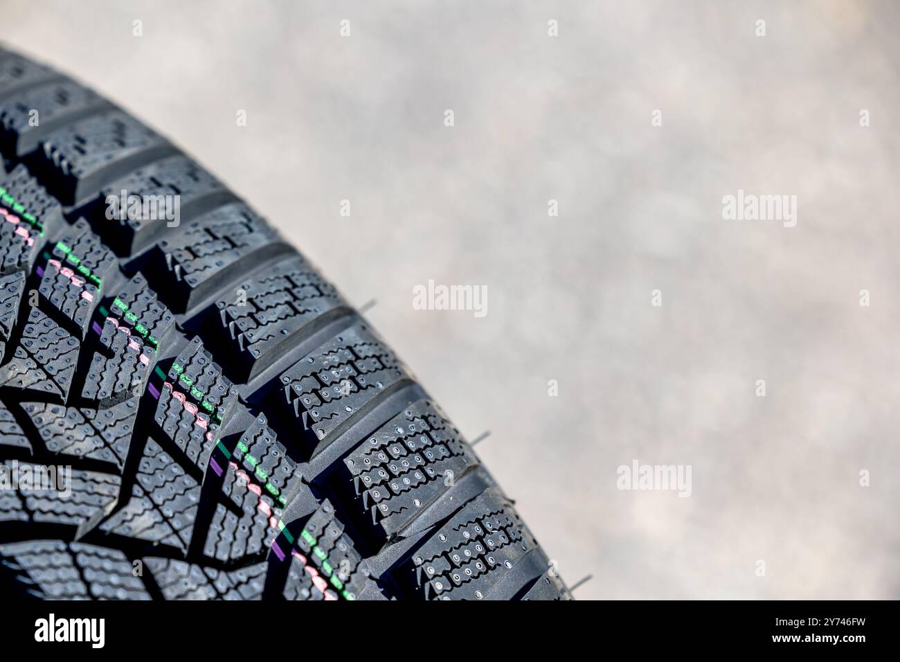 Sharp tread of new winter tires ready for the seasonal change. New ...