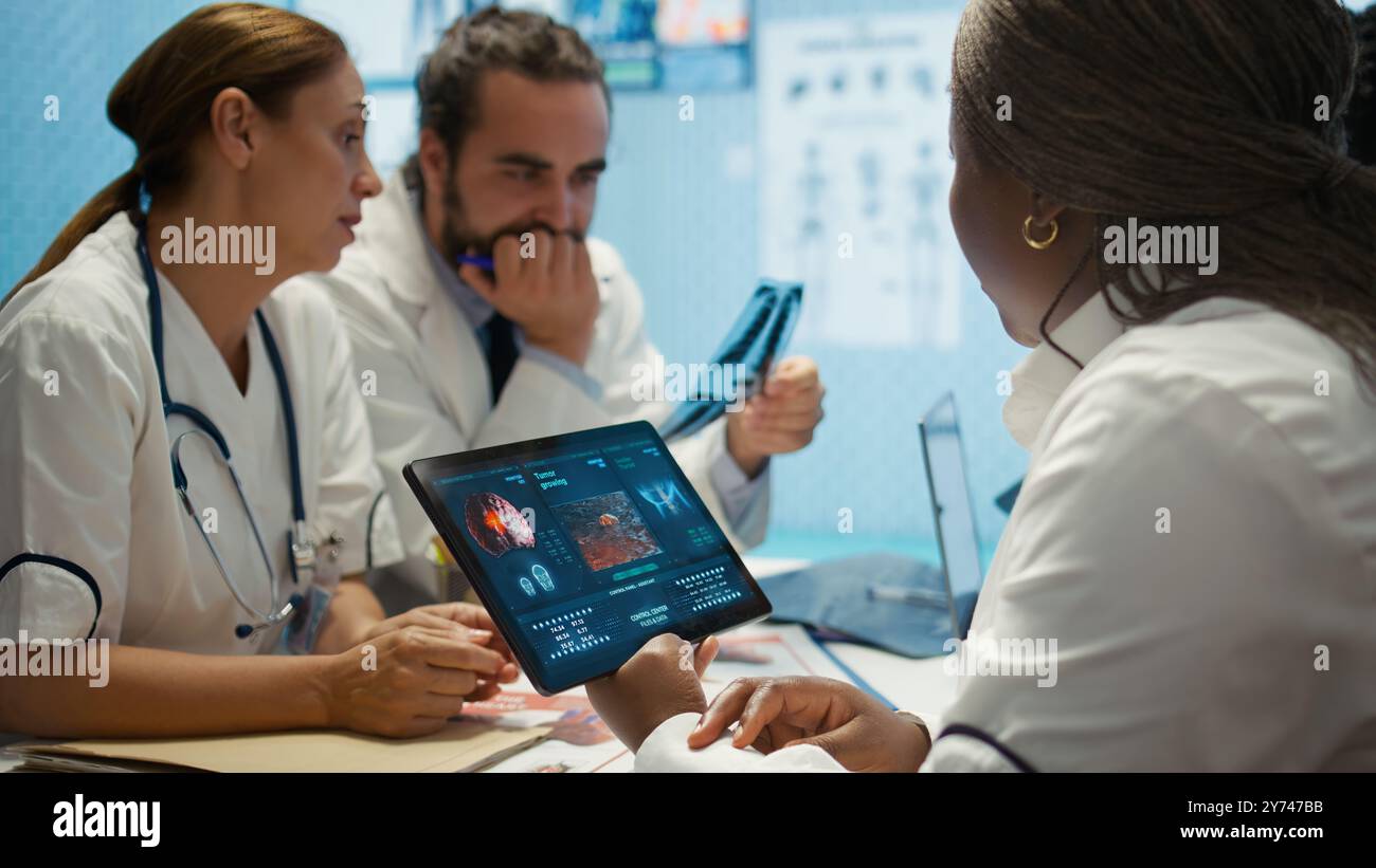 Medical team collaborates on diagnostic procedures and treatment plans ...