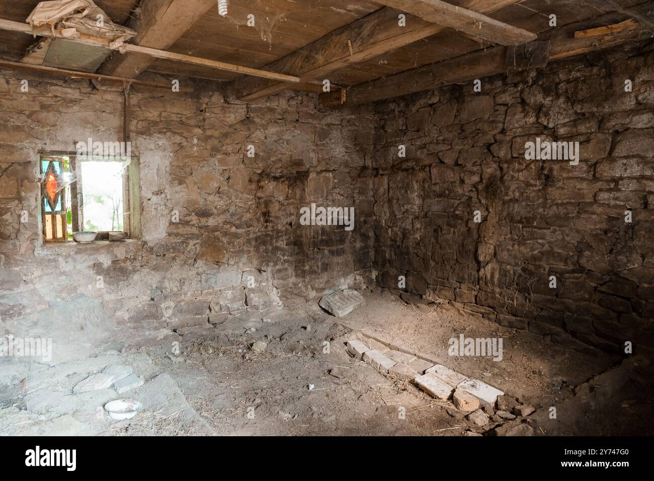 Abandoned Stone Room with Natural Light Through a Small Window Stock ...