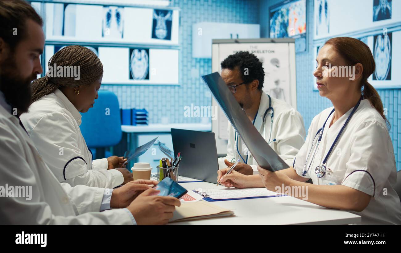 Medical expert reviews x ray results and discusses disease prevention ...