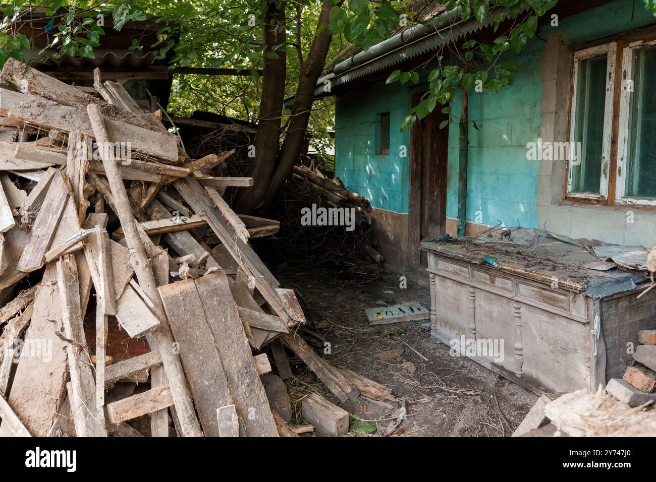 Abandoned House Surrounded by Nature and Timber Debris Stock Photo - Alamy