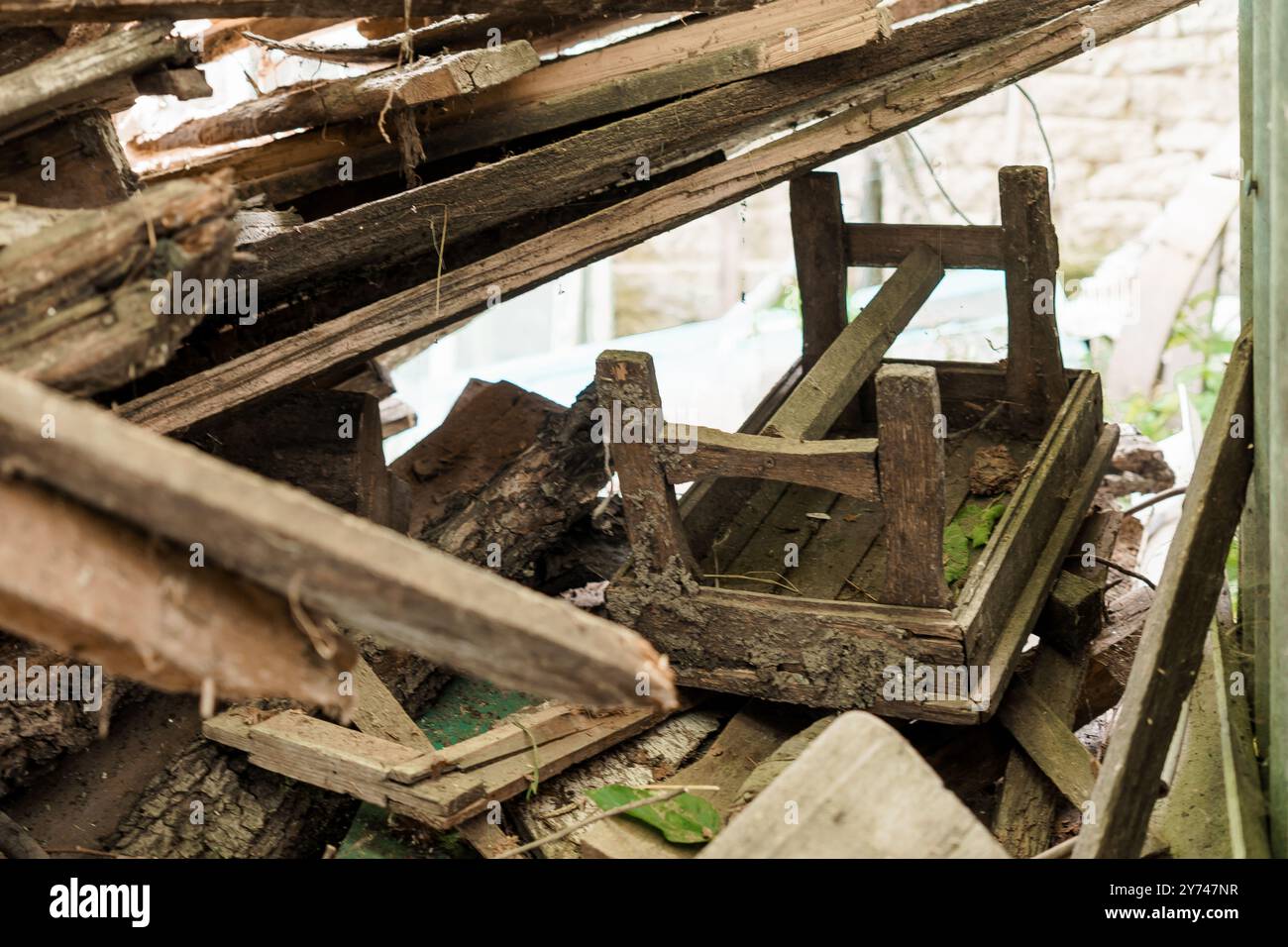 Abandoned Wooden Cart Hidden Amongst Weathered Planks in a Forgotten ...