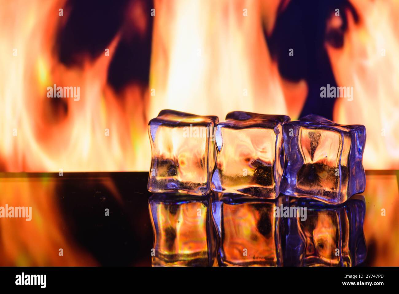 ice cubes on fire background for alcoholic cocktail Stock Photo - Alamy