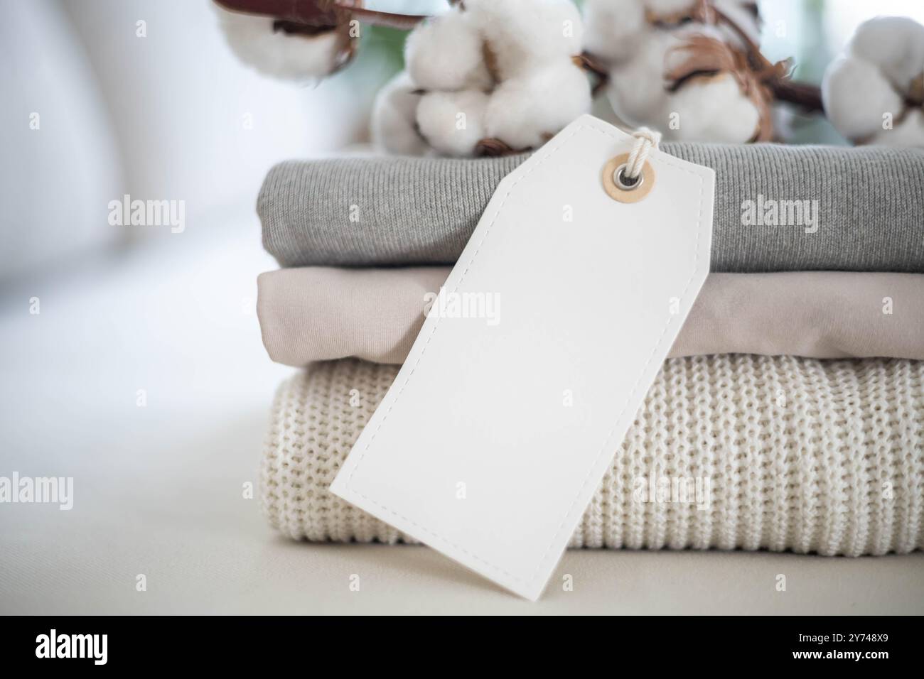 A neat stack of clean knitwear in neutral colors. Concept for sale ...