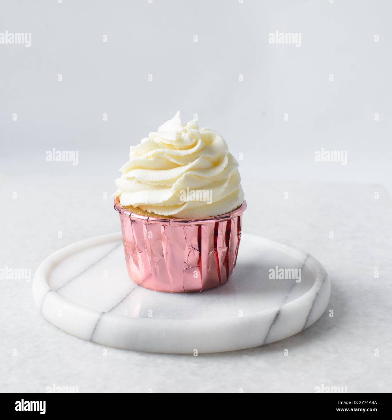 Pink cupcakes with tall buttercream swirl, cupcakes in pink foil liners ...