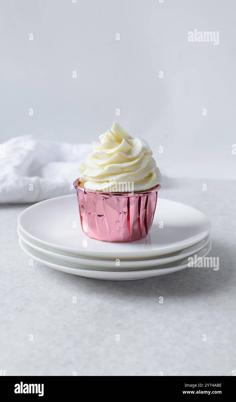Pink cupcakes with tall buttercream swirl, cupcakes in pink foil liners ...