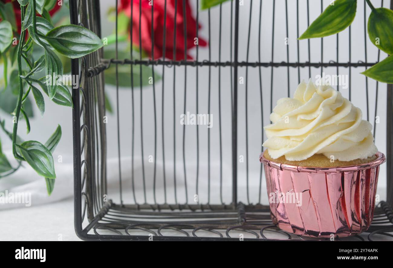 Pink cupcakes with tall buttercream swirl, cupcakes in pink foil liners ...