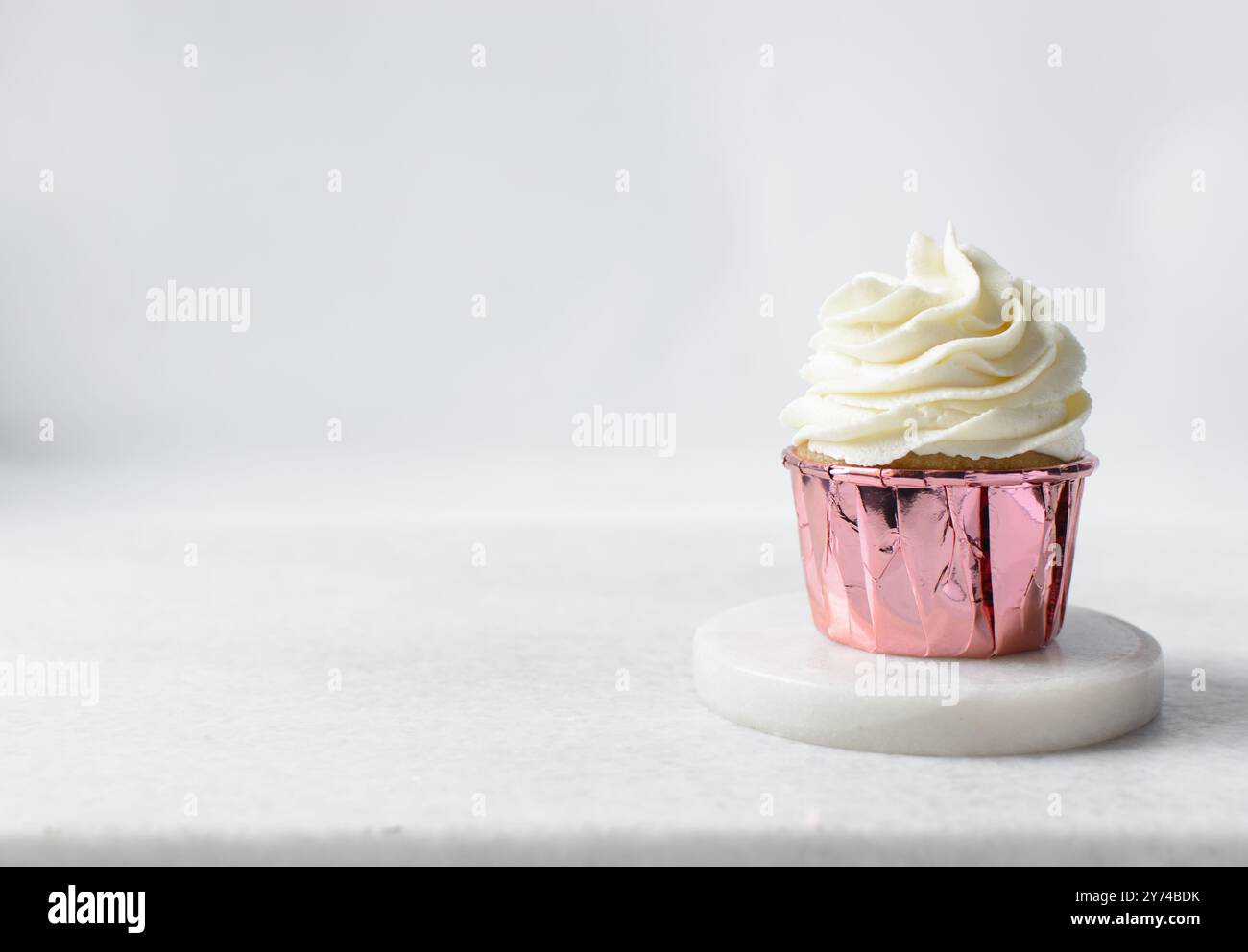 Pink cupcakes with tall buttercream swirl, cupcakes in pink foil liners ...