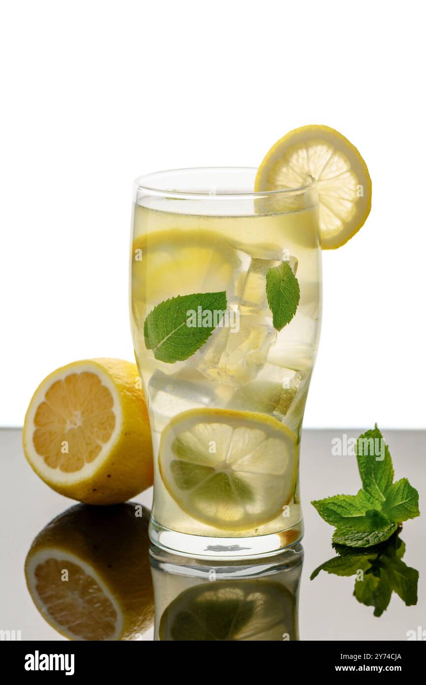 Fresh lemon drink with ice isolated on white background Stock Photo - Alamy