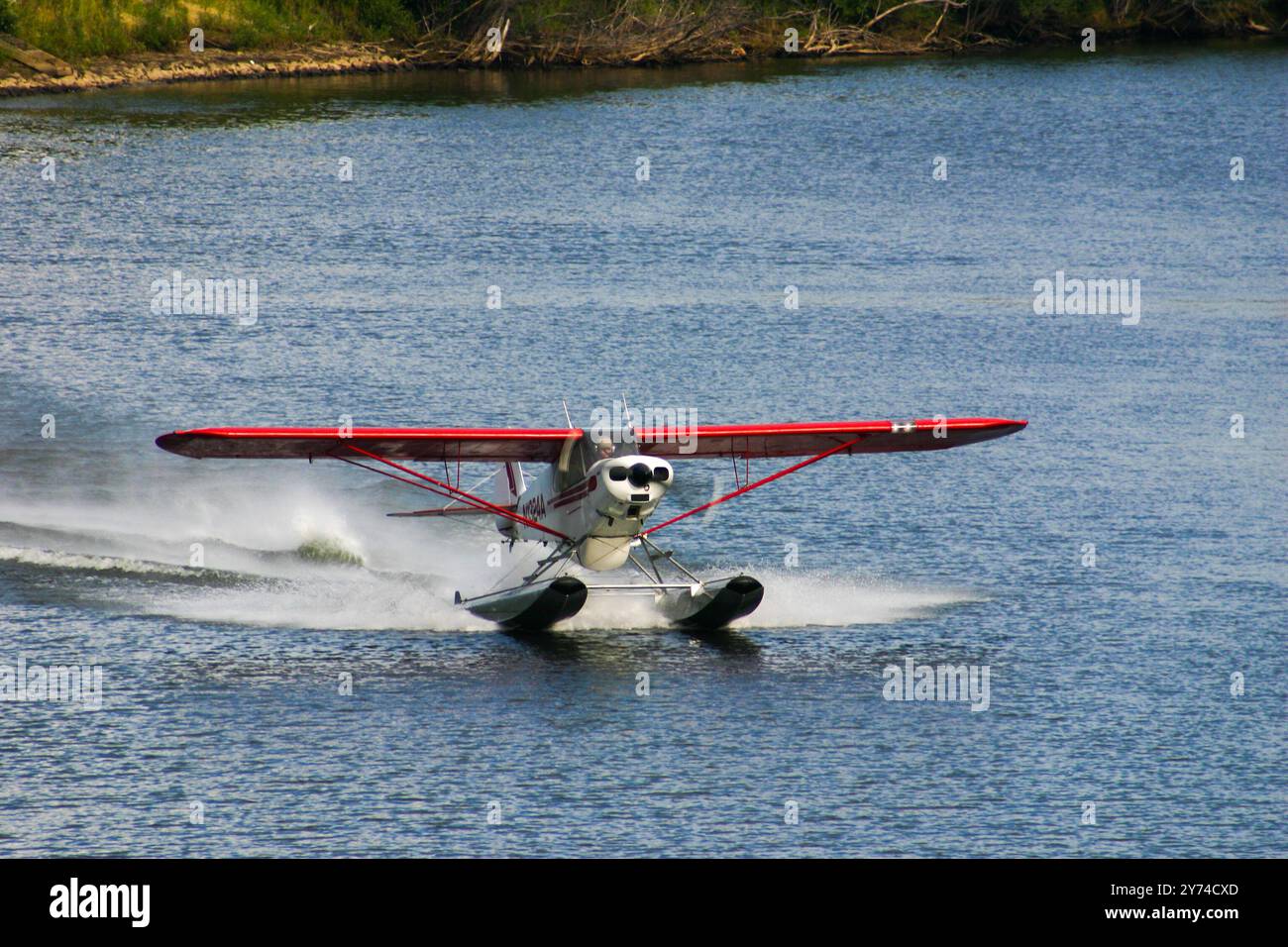A Bush Float Plane taking off from the water Stock Photo - Alamy