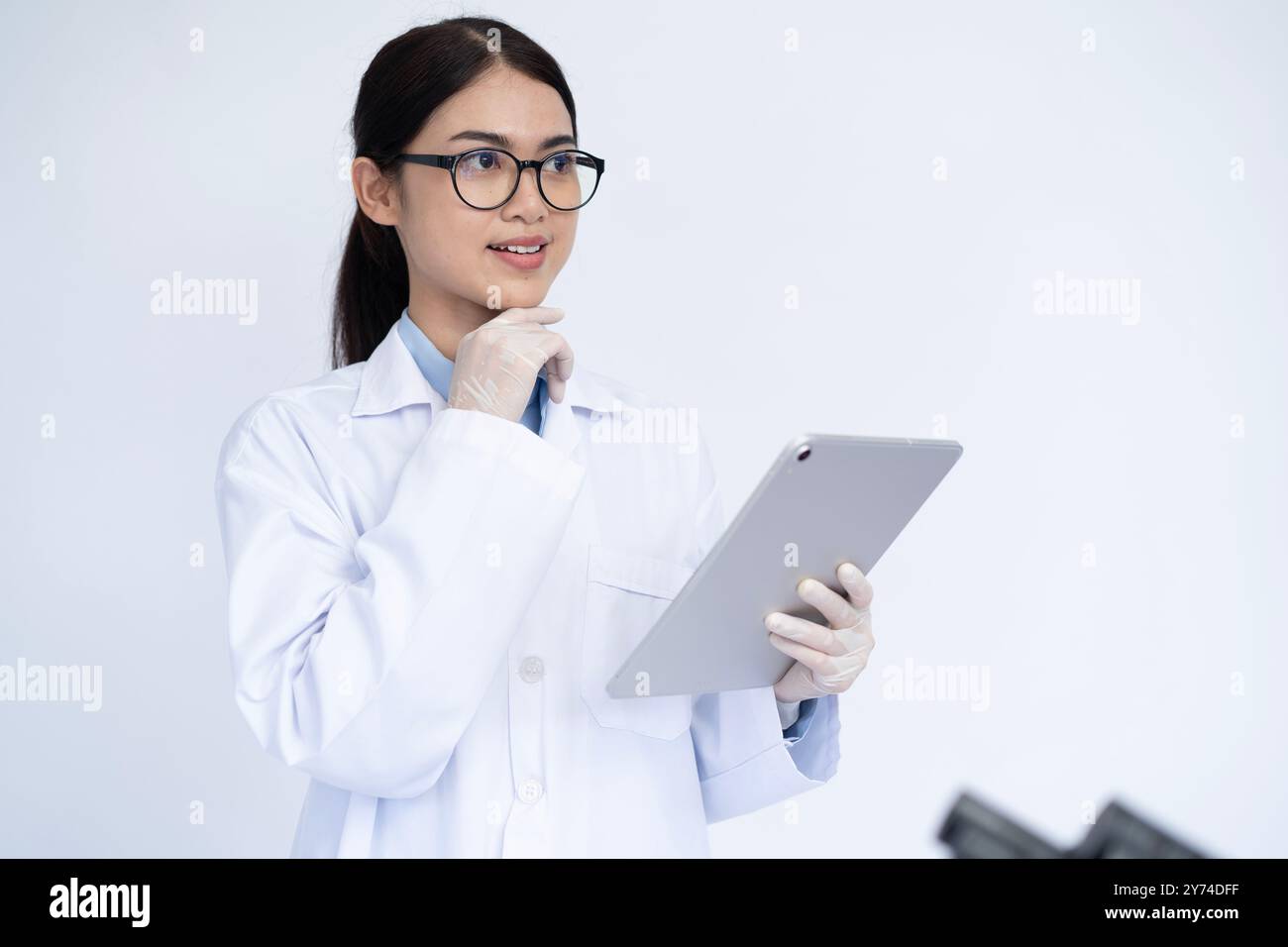 Scientist in laboratory analyzing digital hi-res stock photography and ...