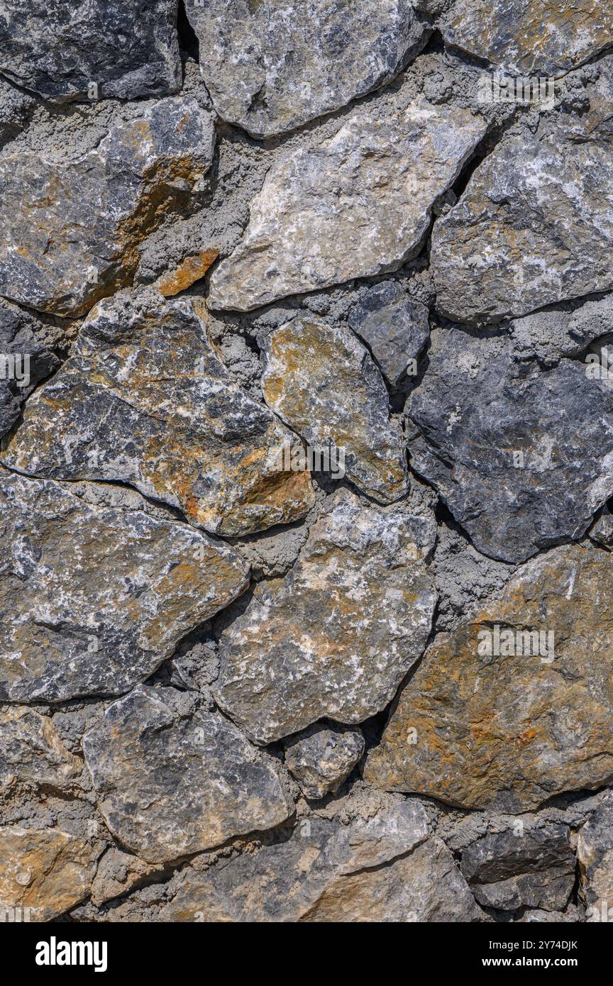 Stone wall texture background - grey stone siding with different sized ...