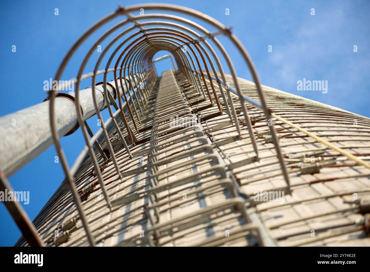 Photography of a view of looking up through the caged ladder on a grain ...