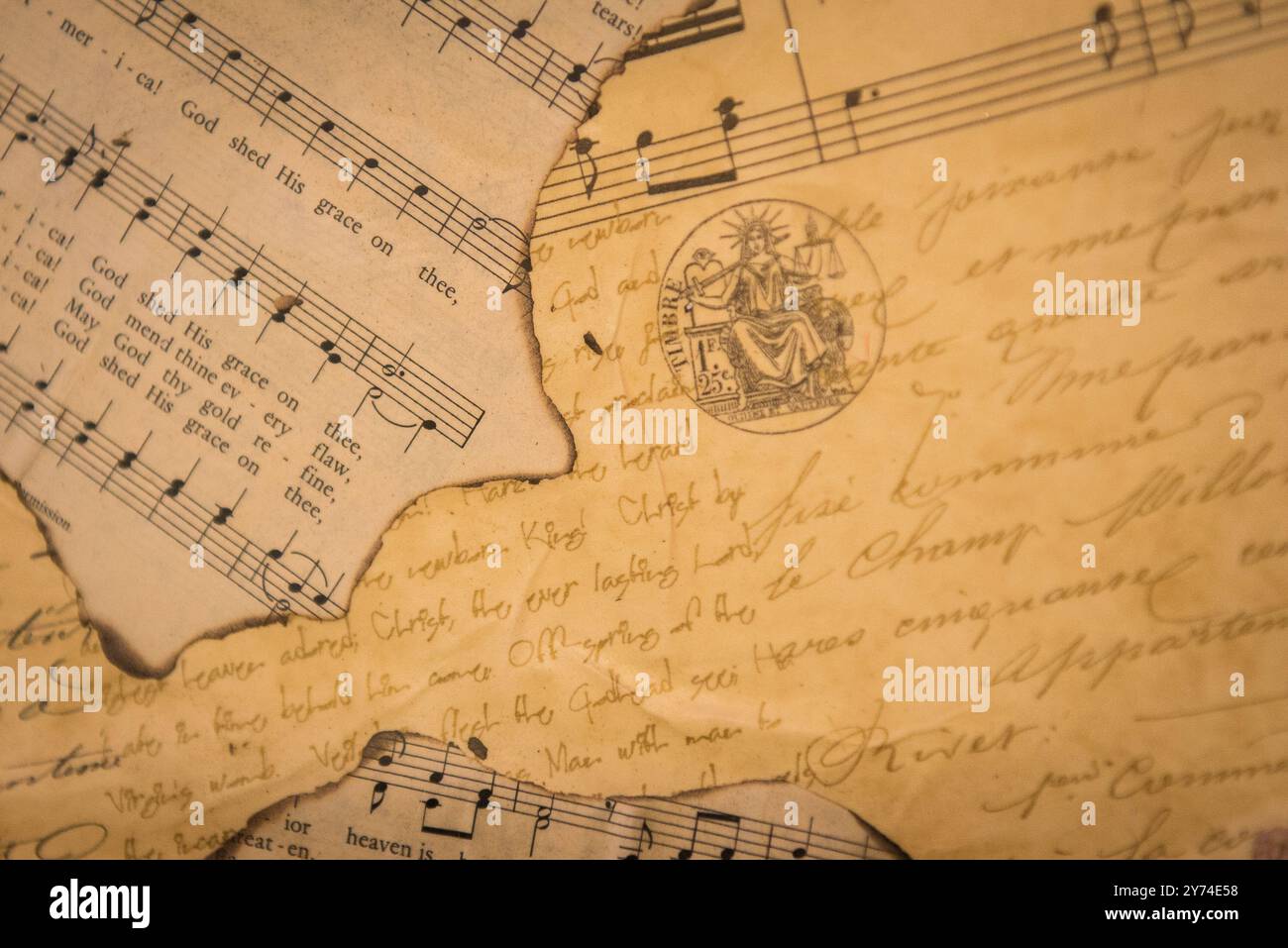 Close up photography of antique torn and charred sheets of music scores ...