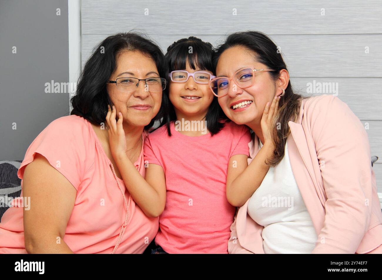 Three Generations of women Grandmother, mom and brunette Latina ...