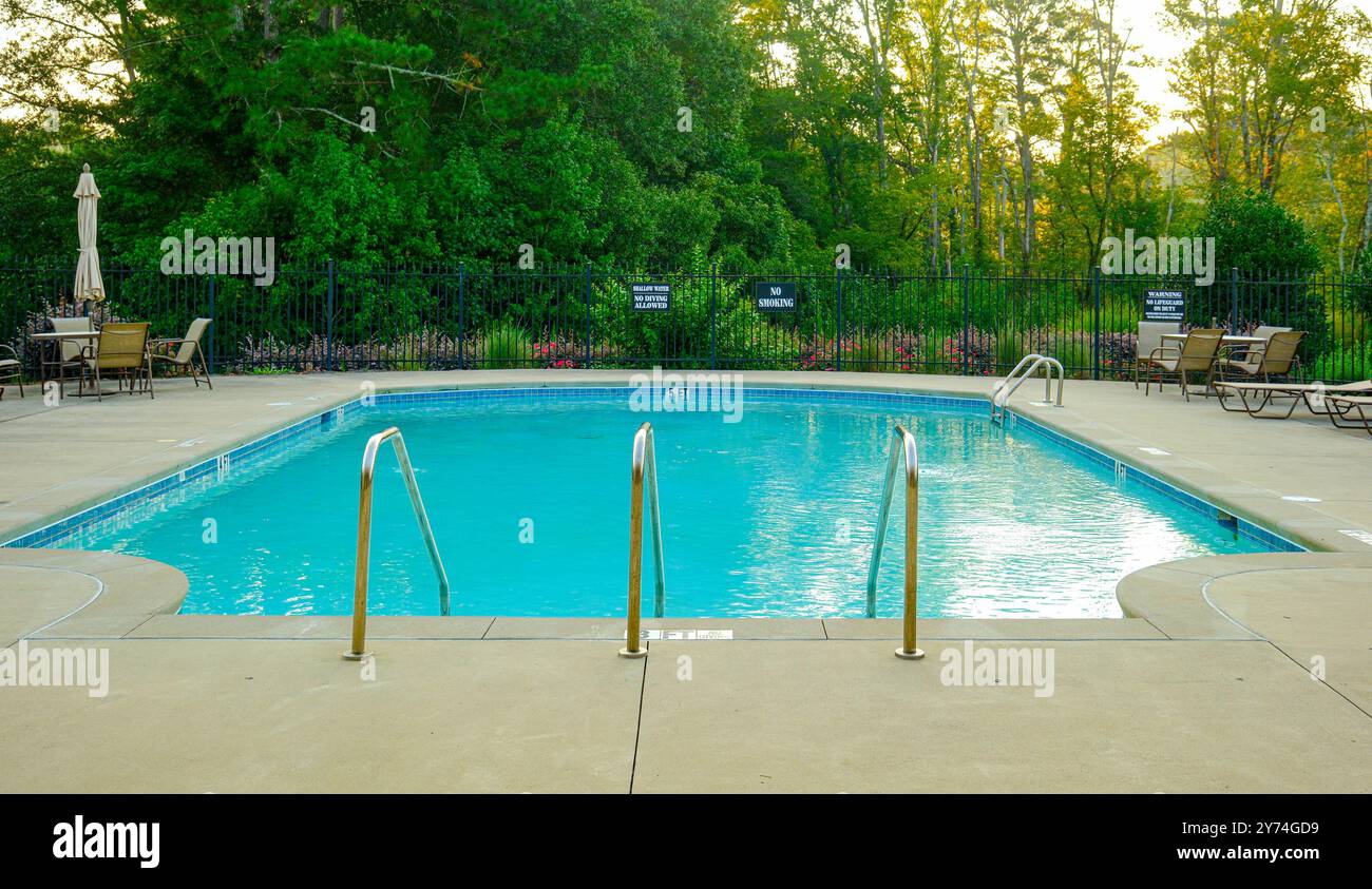 Residential Swimming Pool with Handrails and Signage Stock Photo - Alamy