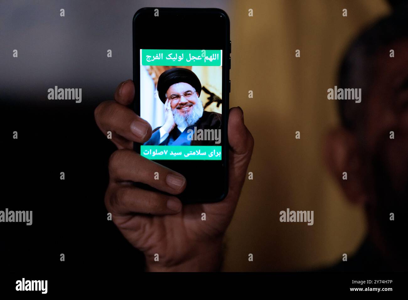 An Iranian demonstrator shows a portrait of Hezbollah leader Hassan ...