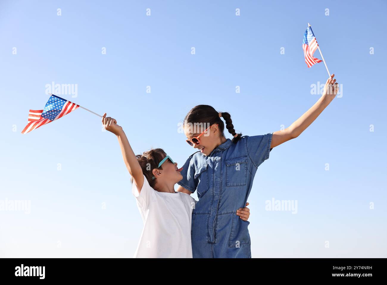 Brother and sister with flags of USA outdoors Stock Photo - Alamy