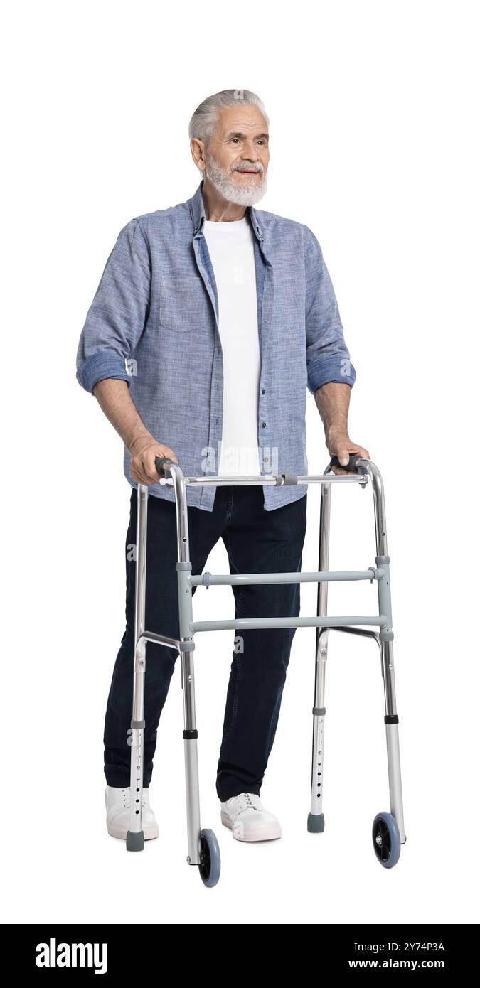 Senior man using walking frame on white background Stock Photo - Alamy
