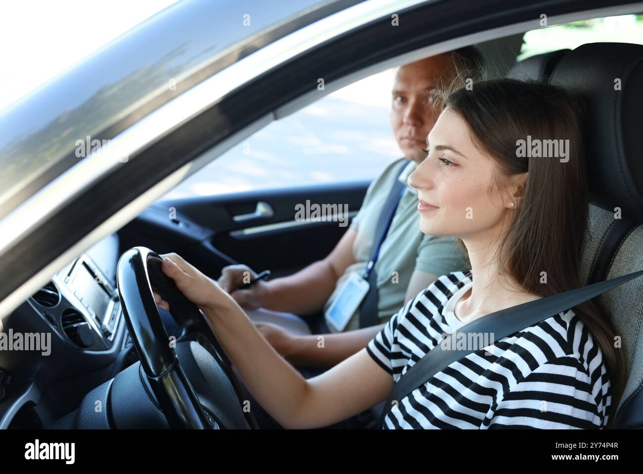 Driving school. Student passing driving test with examiner in car Stock ...