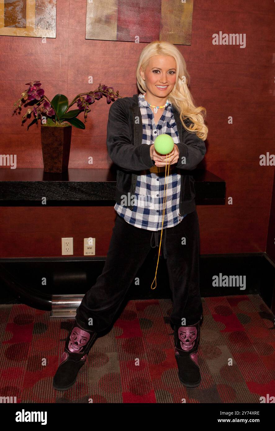 Holly Madison pictured playing with a classic Ice Cream Punch Cone toy ...