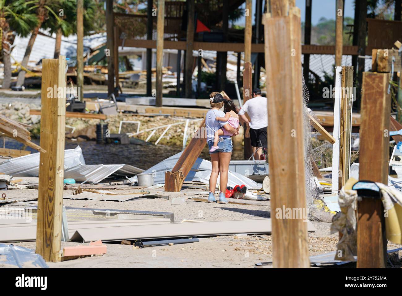 Residents are seen surveying the damage from Hurricane Helene on ...