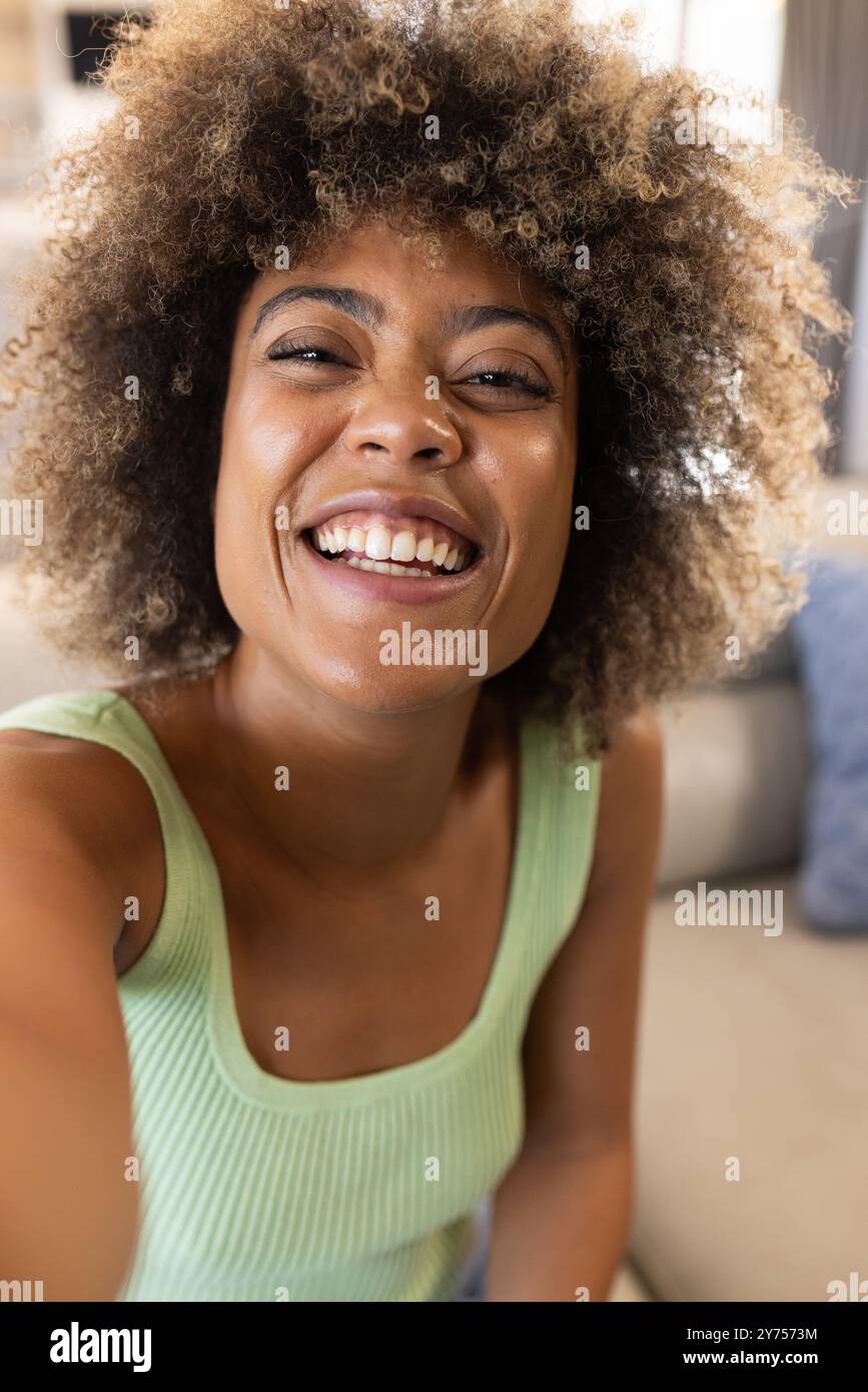 On video call, Smiling woman, at home Stock Photo - Alamy
