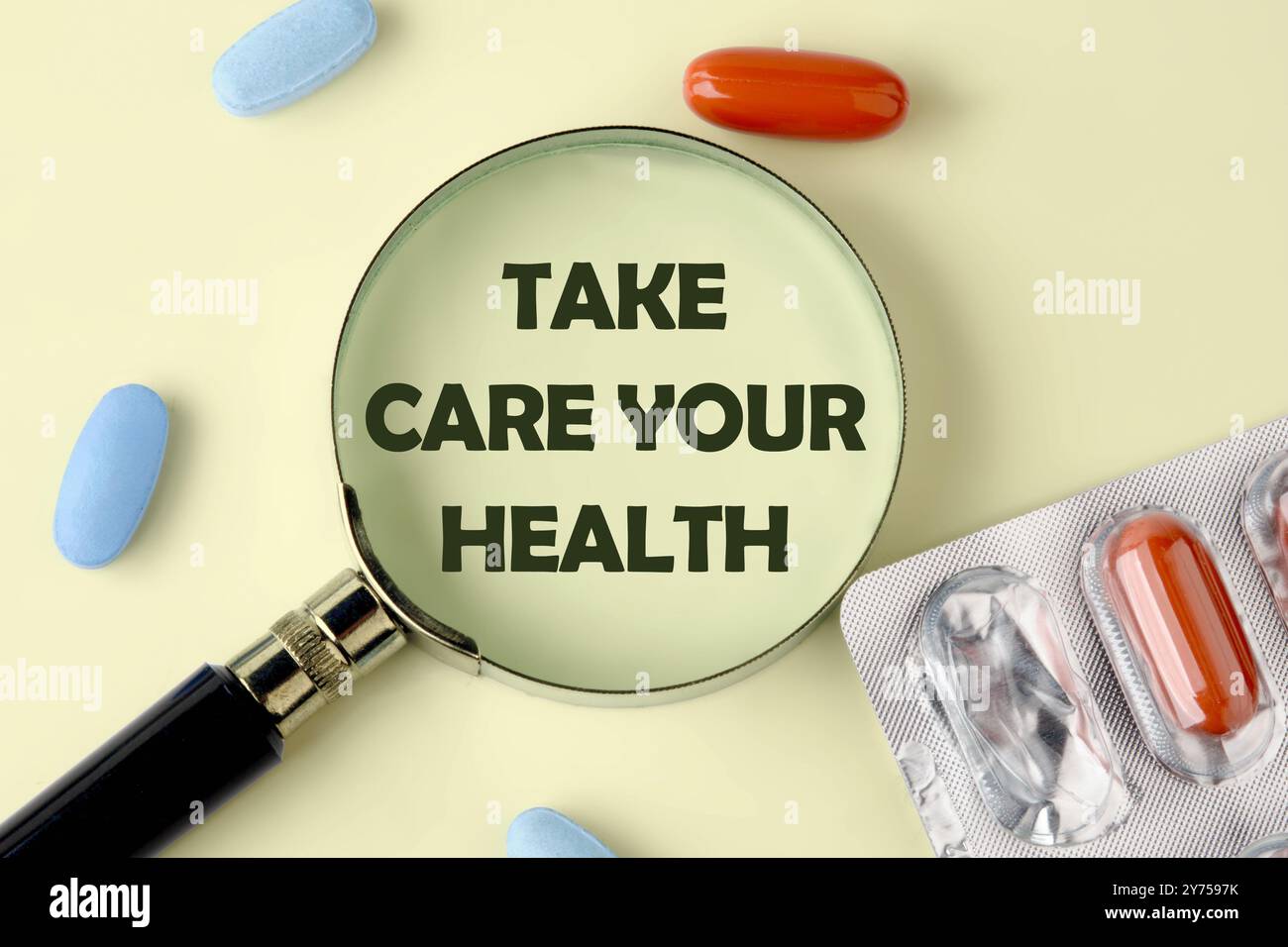 TAKE CARE YOUR HEALTH written on a yellow background through a ...