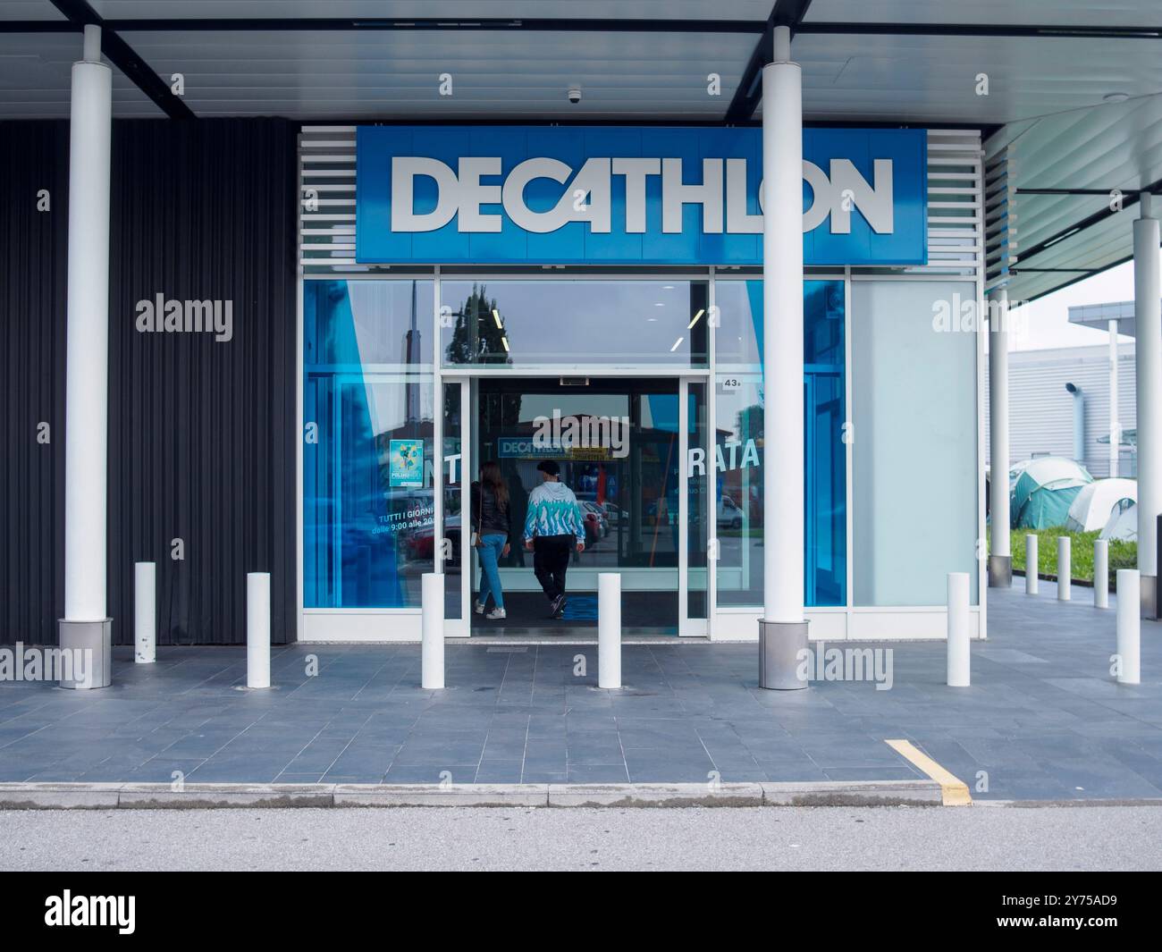 Cremona, Italy September 26th 2024 Customers entering bustling ...