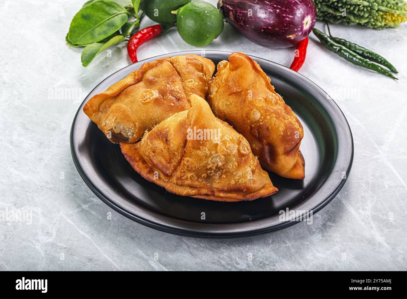 Indian cuisine - fries crispy stuffed samosa Stock Photo - Alamy