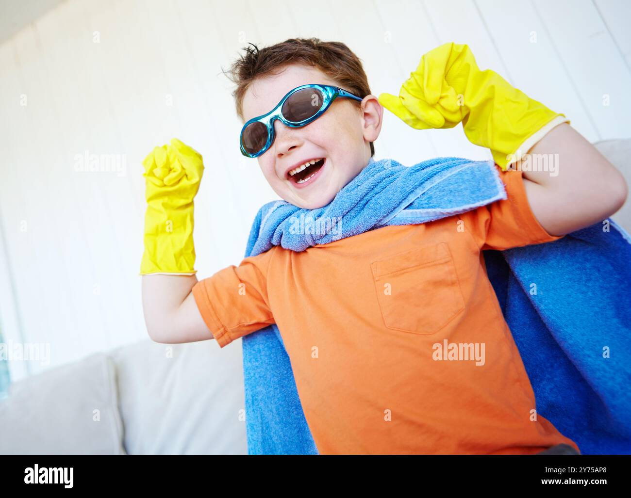 Strong, child and happy superhero in home to play fantasy game on ...