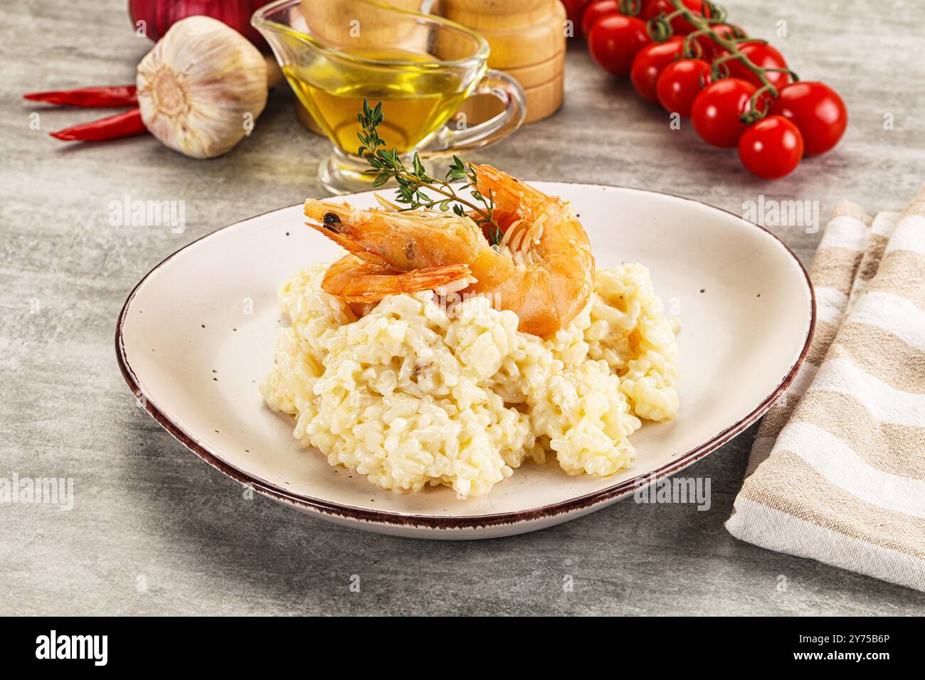 Italian cuisine - risotto with prawn served thyme Stock Photo - Alamy