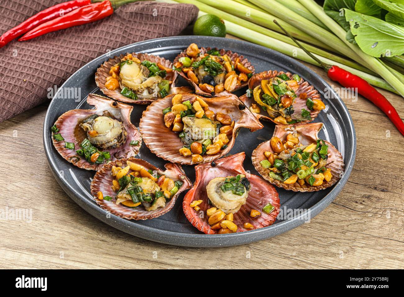 Baked scallops with scalion oil and green onion Stock Photo - Alamy