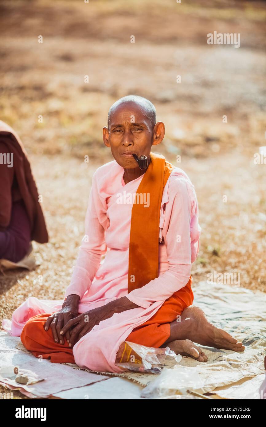 BAGAN, MYANMAR - APRIL 02, 2018: female Buddhist monk smoking a pipe ...
