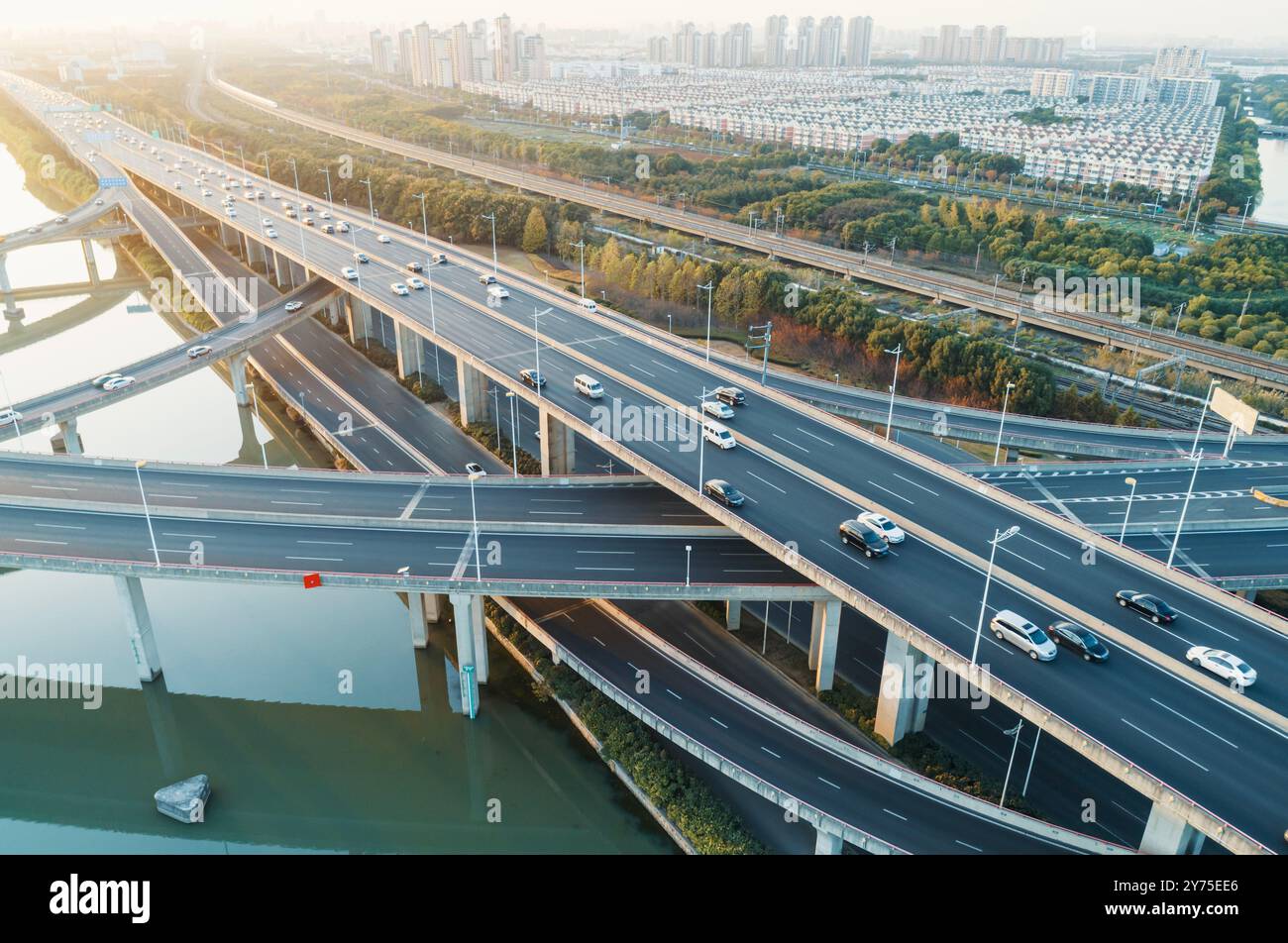 Aerial view of interconnected highways with traffic in a suburban area ...