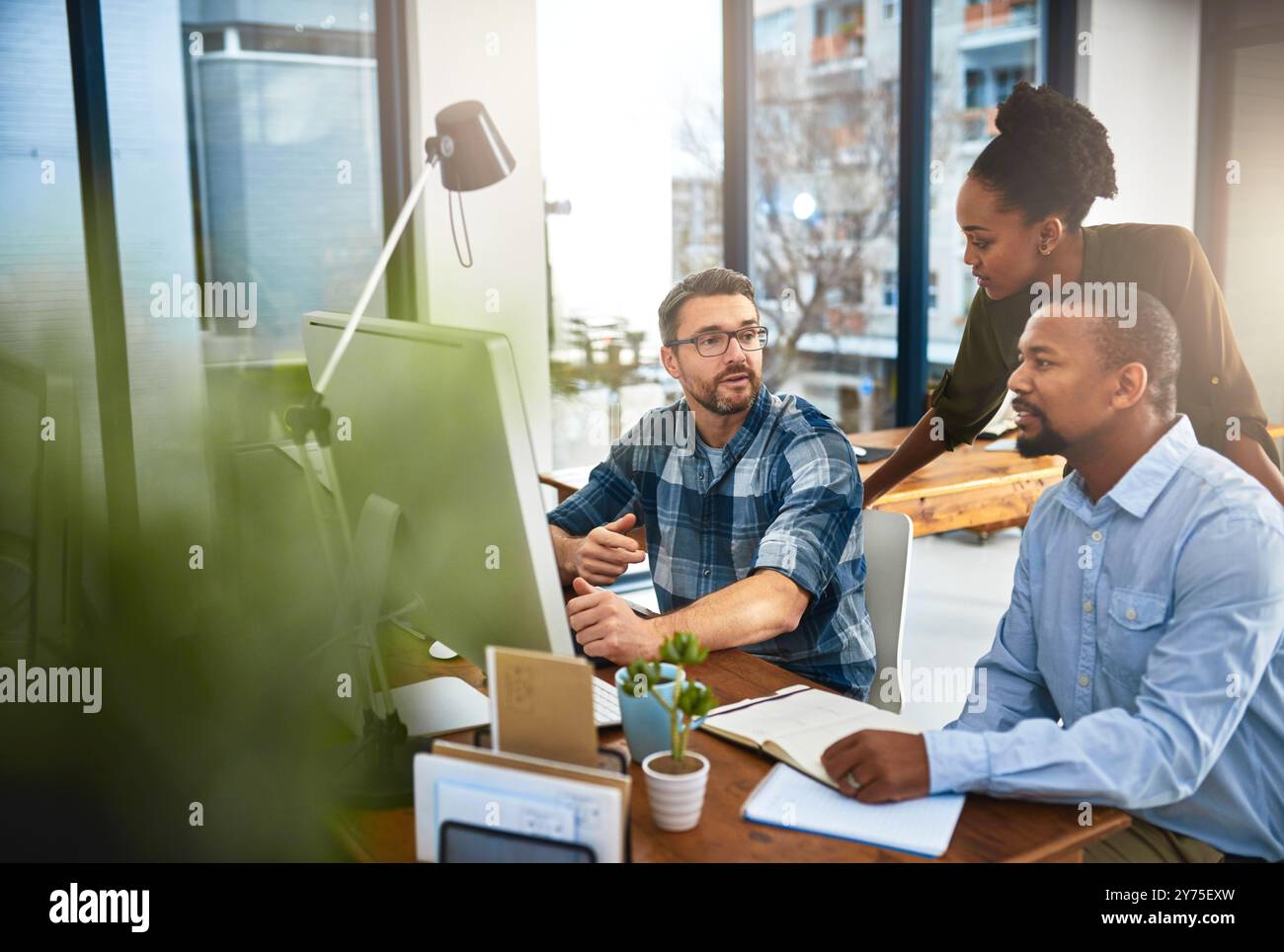 Group, computer and reading of project, talking and intern with lead ...