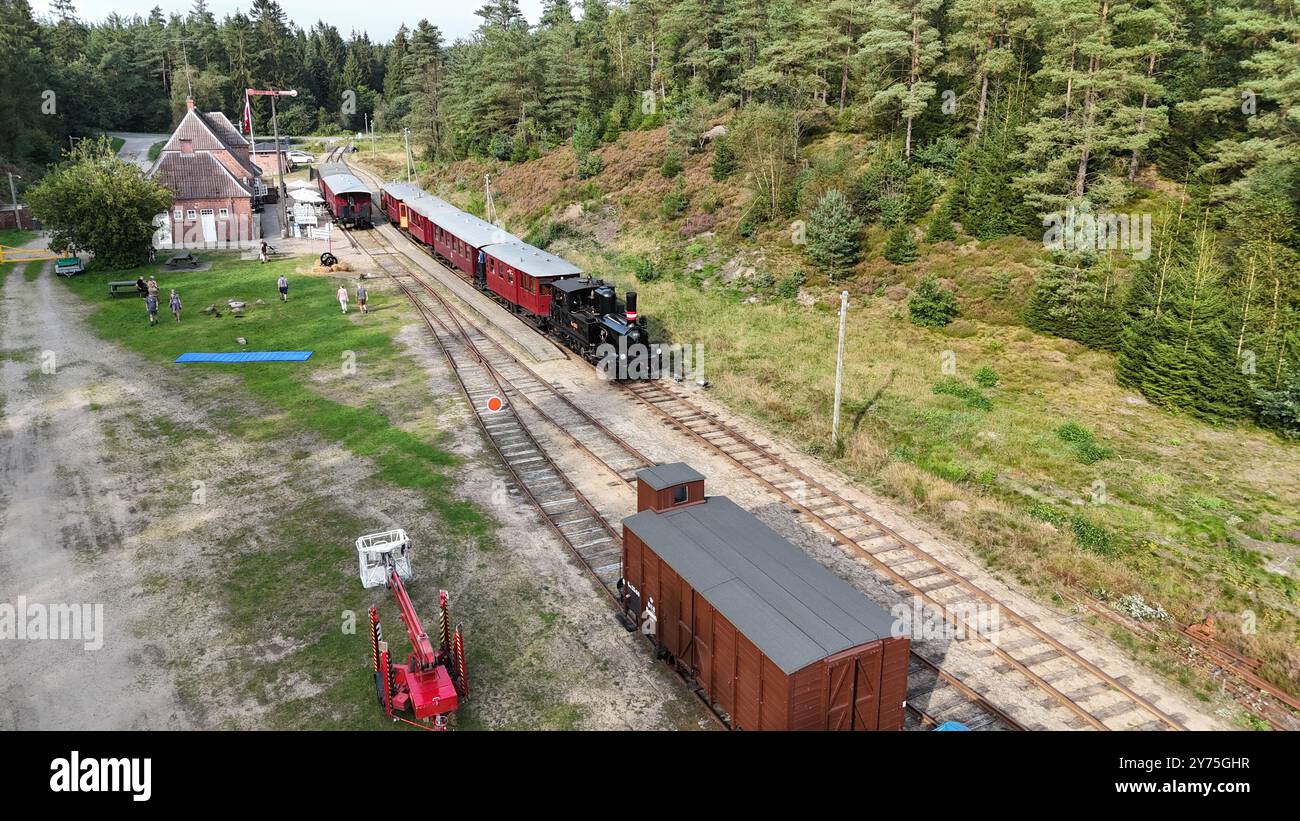 the old steam train from Vrads to Bryrup in denmark with passengers ...