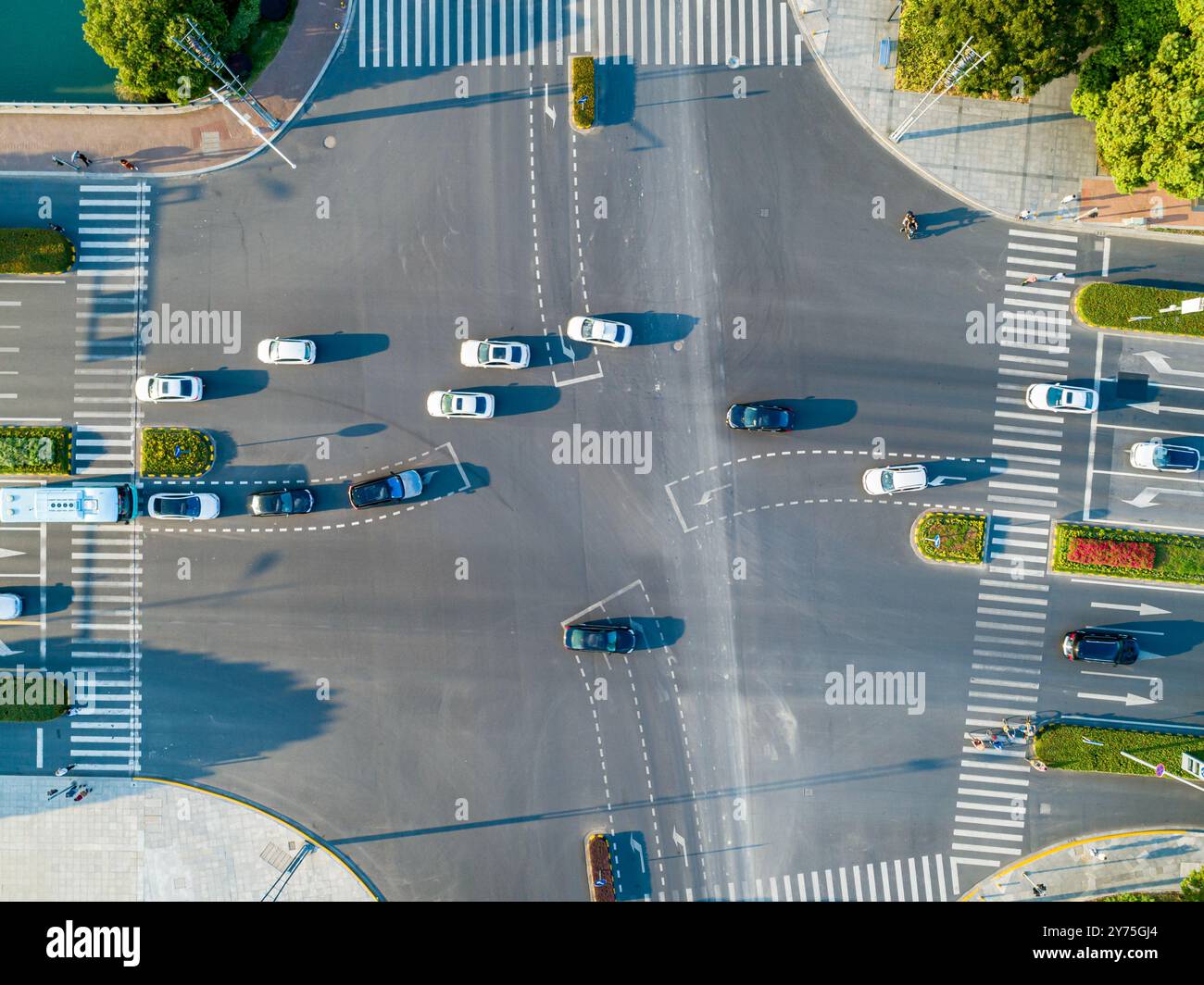 Aerial view of a busy intersection with vehicles navigating traffic in ...