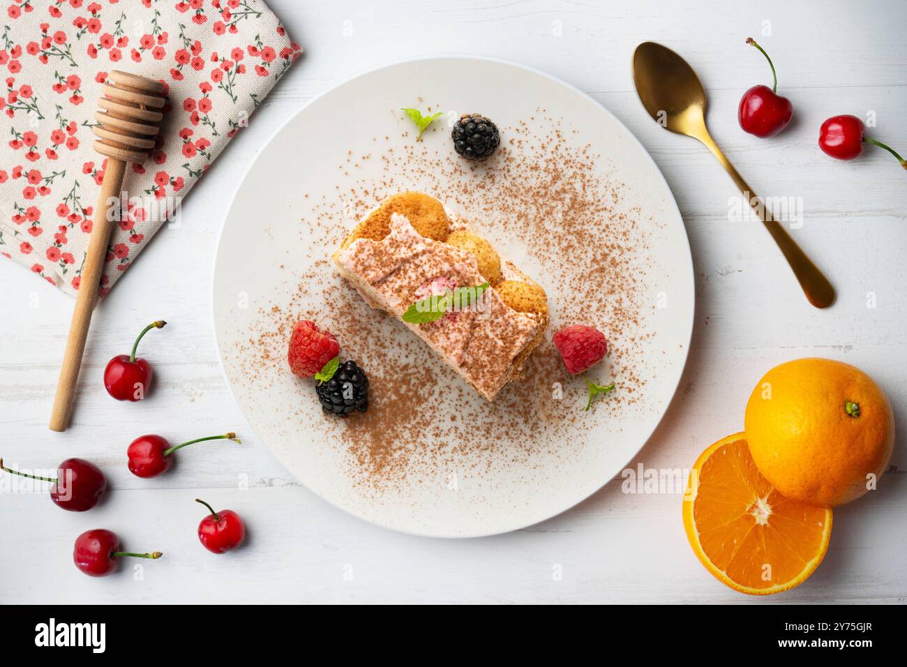 Italian tiramisu with red berry cream. Top view table with decorations ...