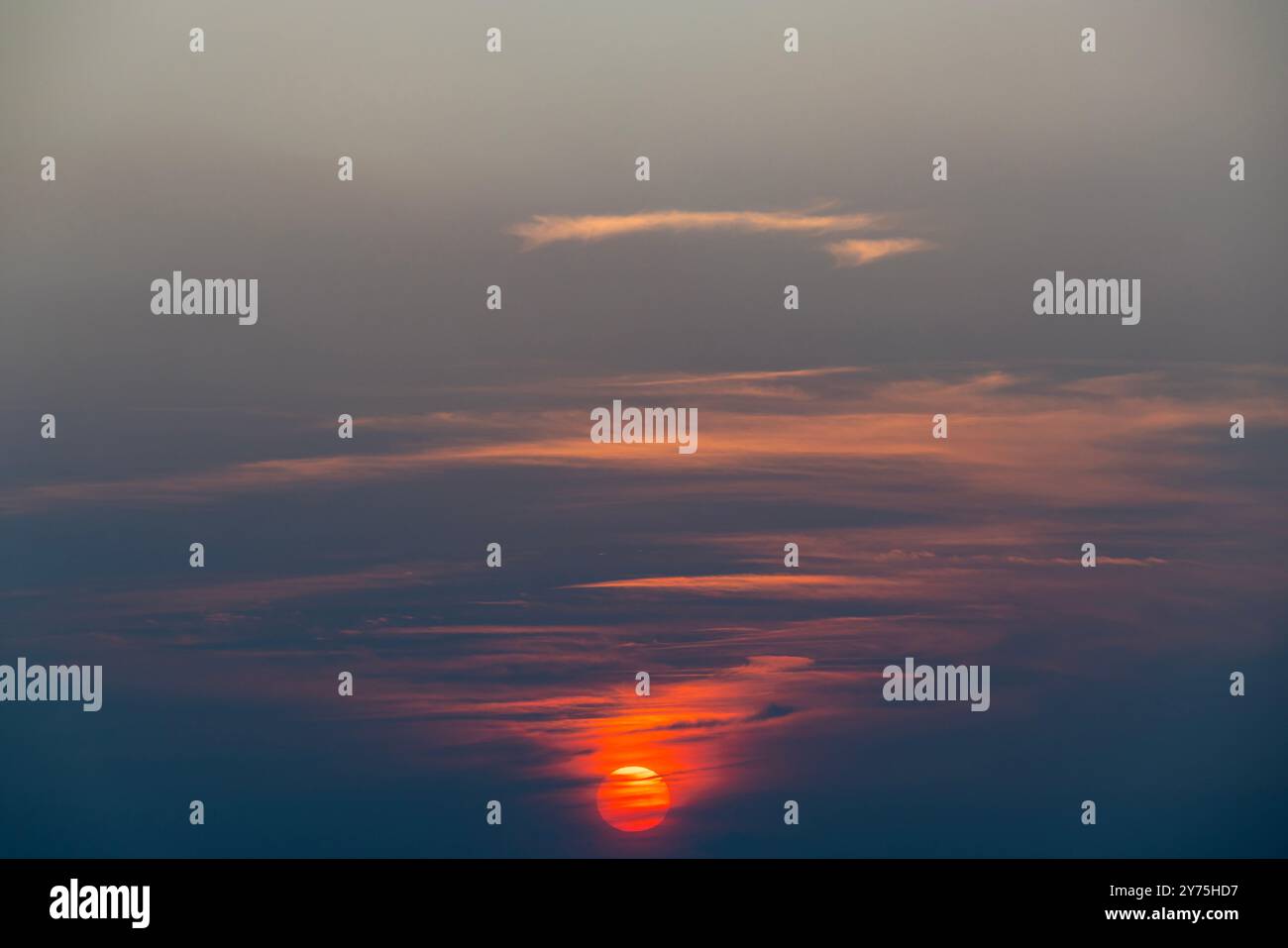 The slowly disappearing into cloud over the Welsh coast at sunset Stock ...