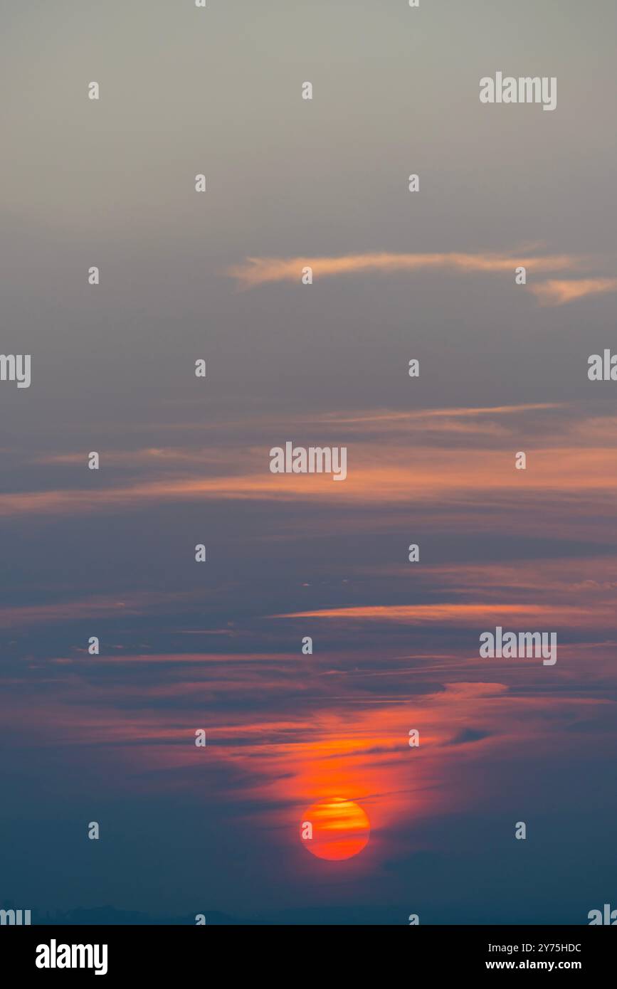 The slowly disappearing into cloud over the Welsh coast at sunset Stock ...