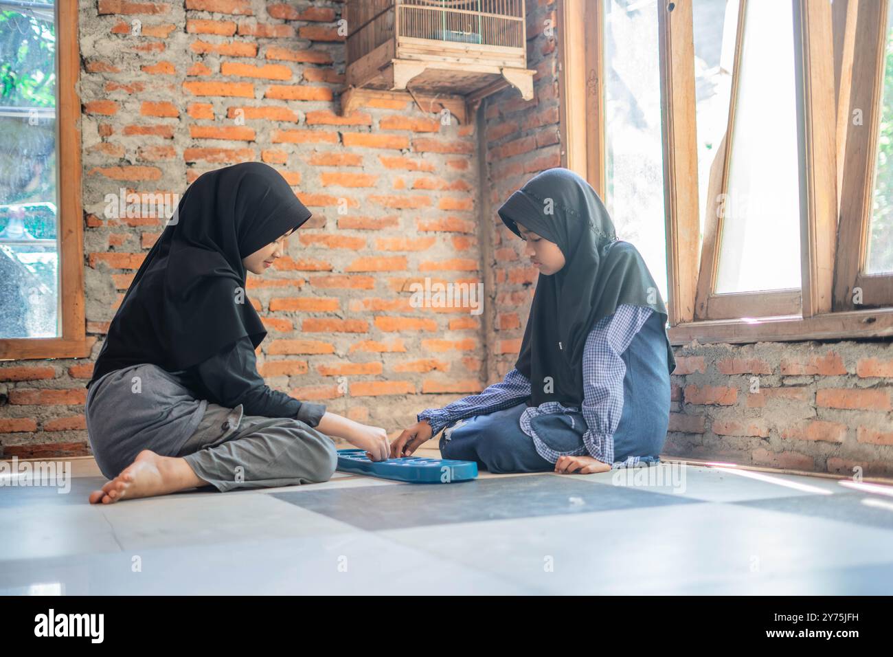 native indonesian girls playing traditional games Stock Photo - Alamy