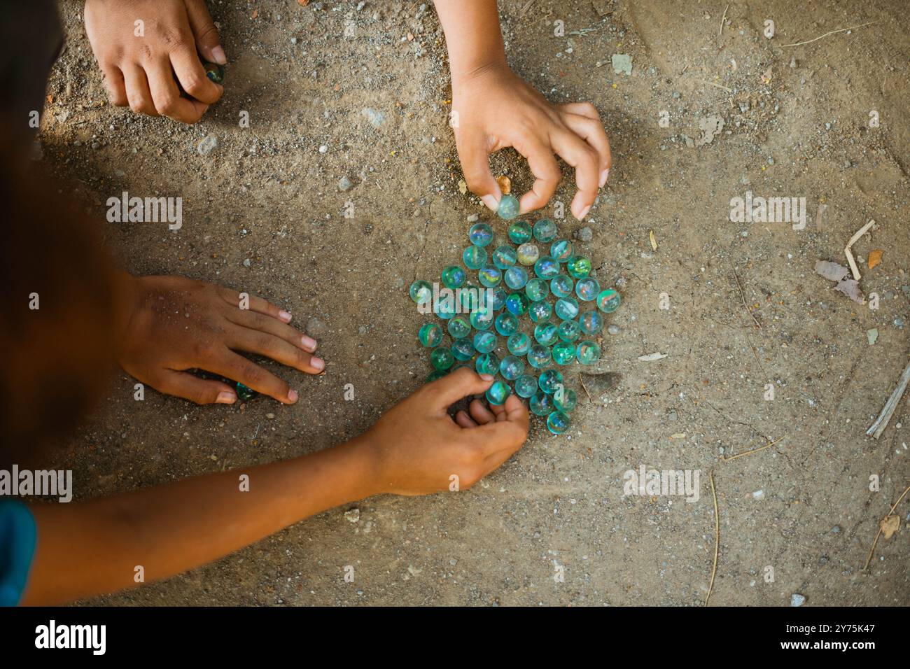 Hand holding marbles hi-res stock photography and images - Alamy