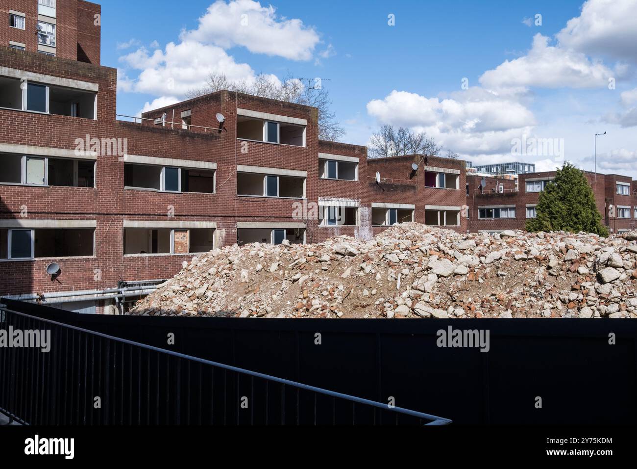 Pile of rubble from demolished tower block outside abandoned council ...