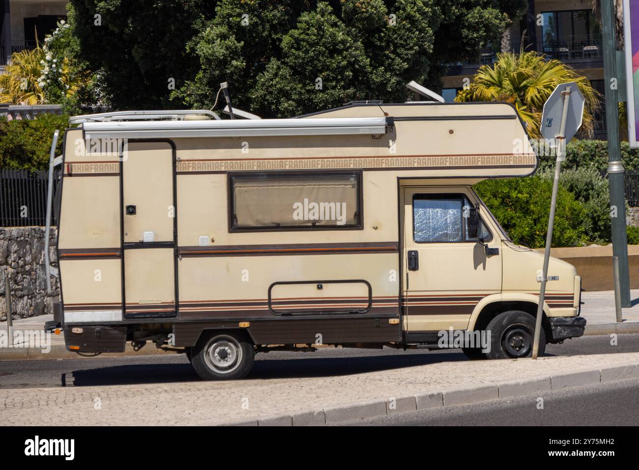 Old and dirty camper van is parked illegally on a european street, its ...