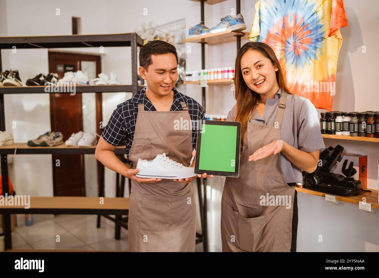 staff holding tablet with mockup screen Stock Photo - Alamy