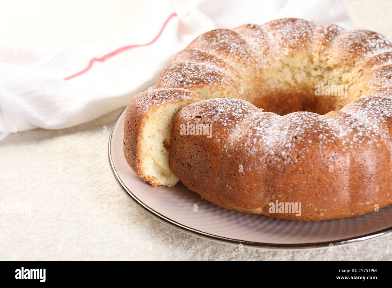 Freshly baked sponge cake on white textured table, closeup Stock Photo ...