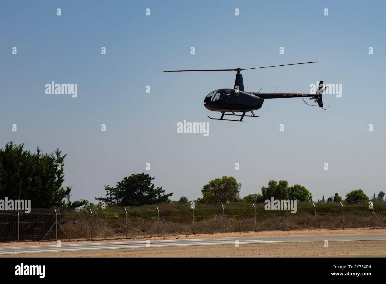 Herzliya, Israel - July 23rd, 2024: A small helicopter coming in for ...
