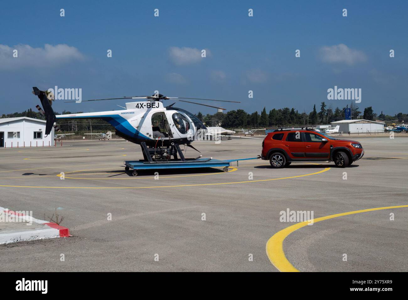 Herzlia, Israel - July 23rd, 2024: A van towing a small helicopter on ...